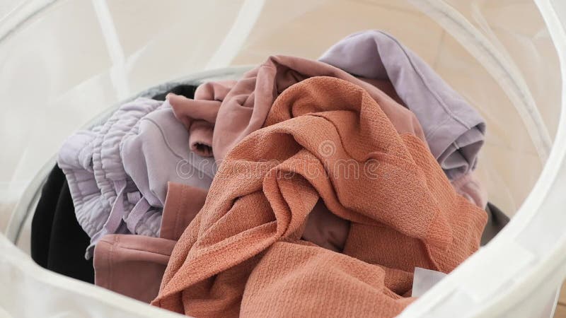 Sorting Laundry in a Basket before Washing on a Sunny Day Stock Footage ...