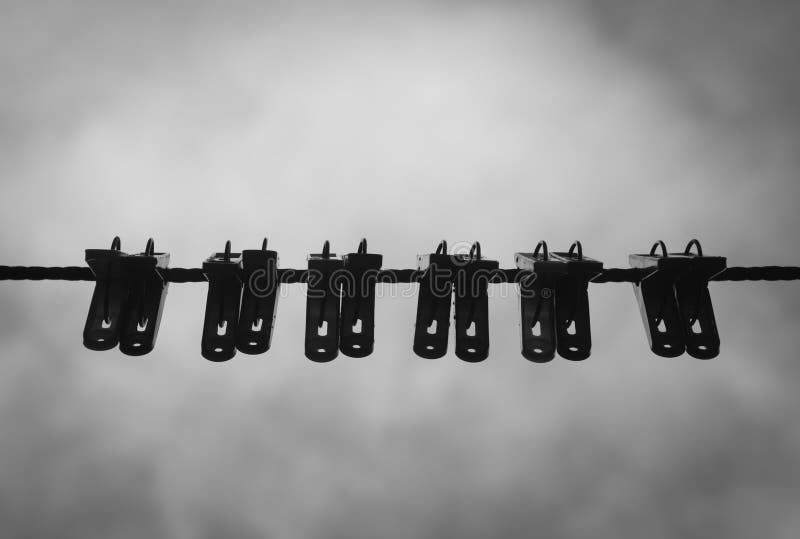 Clothes Pin Creation on a Rope Stock Photo - Image of monochrome ...