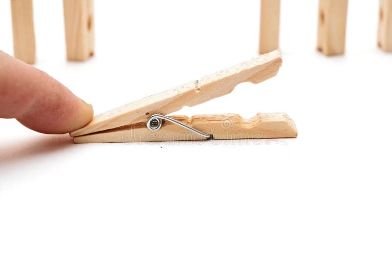 Clothes pin in hand stock photo. Image of fastener, holding - 24592402