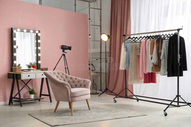 Clothes on Rack and Makeup Table in Studio Setting Stock Illustration ...