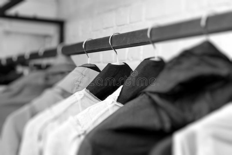 Clothes on racks stock image. Image of mall, business - 16112871