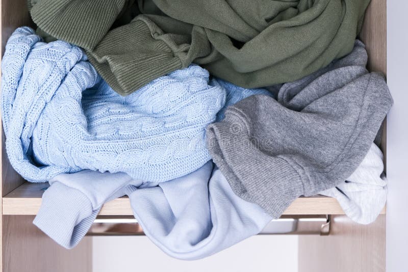 Clothes Scattered in a Mess on a Wardrobe Shelf, Organization and ...