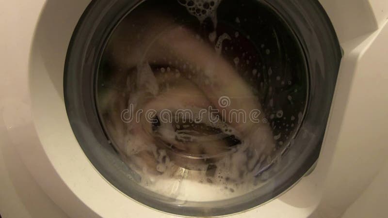 Clothes Spin in the Washing Machine. Washing Process. Timelapse. Stock ...