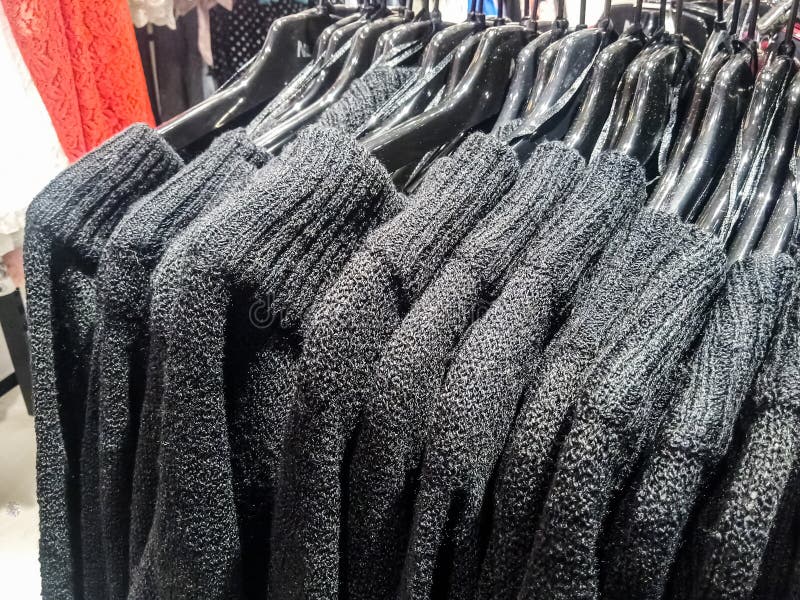 Clothes on a Trempel, on a Hanger Stock Image - Image of black, color ...