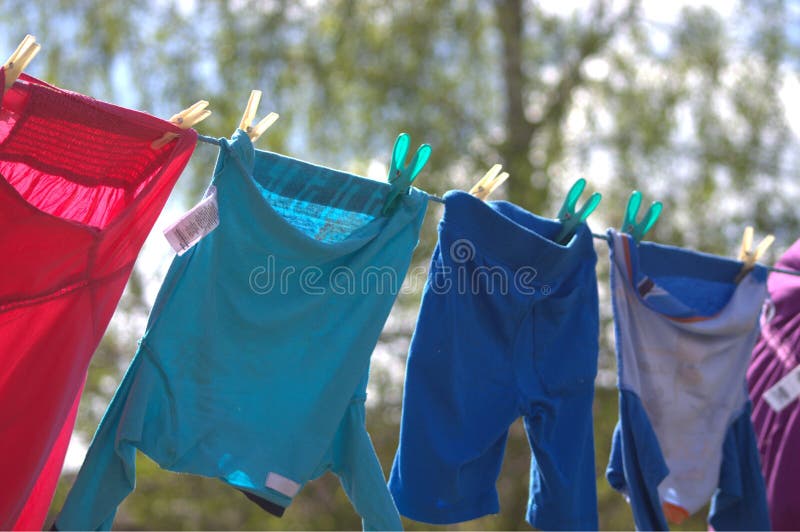Wind Blowing Clothes Stock Photos - Download 1,561 Royalty Free Photos