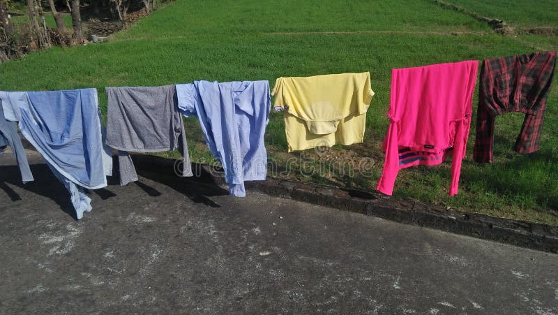 Clothes on the Wire Colourful Clothes Stock Image - Image of blue, wire ...