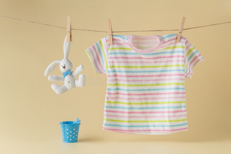 Clothesline with Toy Doll and Baby Clothes Stock Image - Image of baby ...