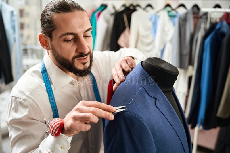 Clothier Removing White Stitches from Client Suit Stock Photo - Image ...