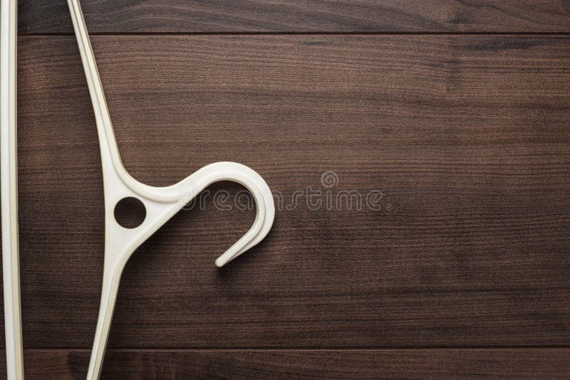Clothing Hanger on Brown Table Stock Photo - Image of domestic, fashion ...