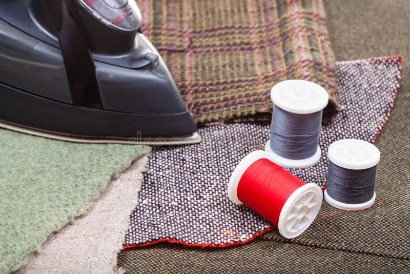 Clothing Iron and Thread Spools on Tissue Stock Photo - Image of ...