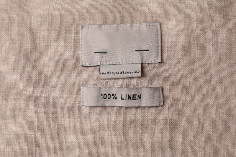 Clothing Label on Beautiful Beige Garment, Top View Stock Image - Image ...