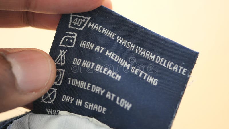 Clothing Label with Care Symbols on a Cloth Stock Footage - Video of ...