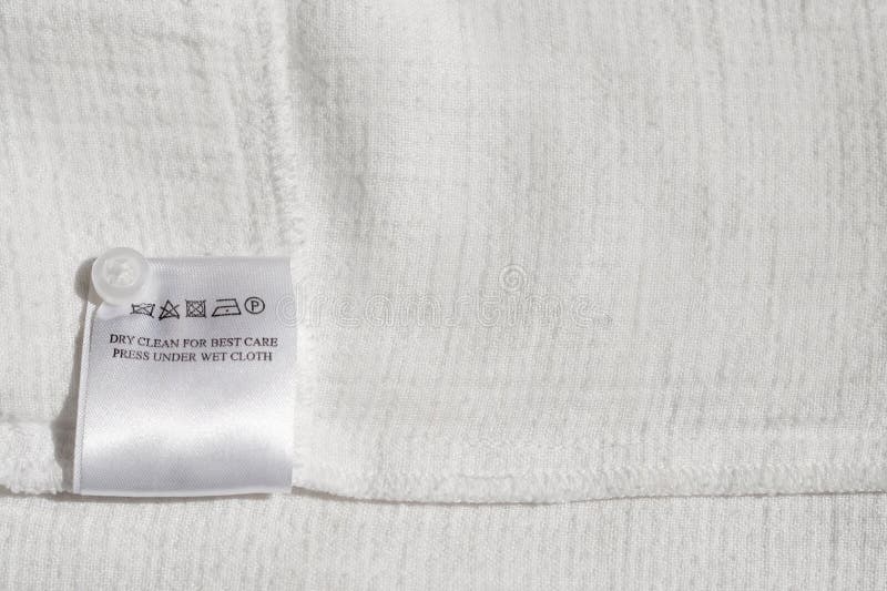 Clothing Label with Instruction on White Garment, Top View. Space for ...