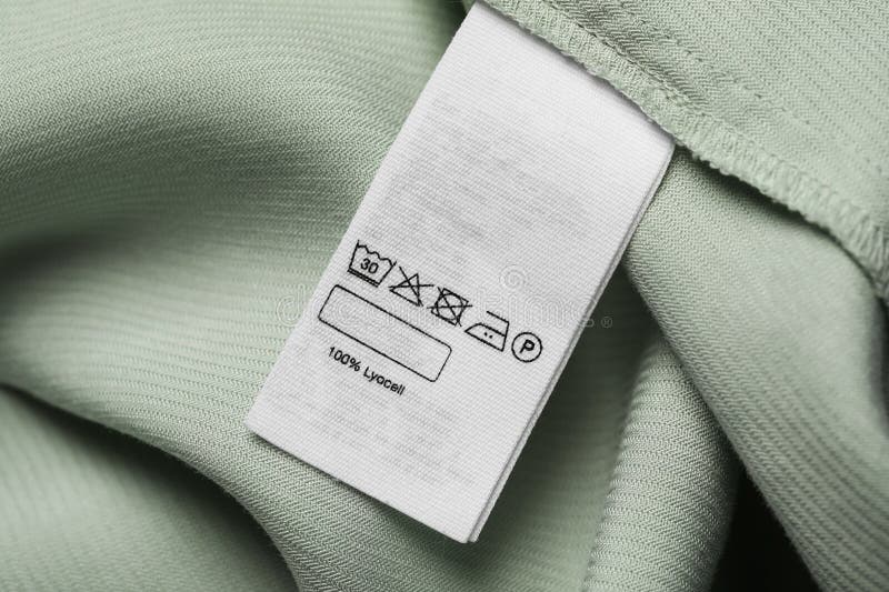 Clothing Label on Light Green Garment, Top View Stock Image - Image of ...