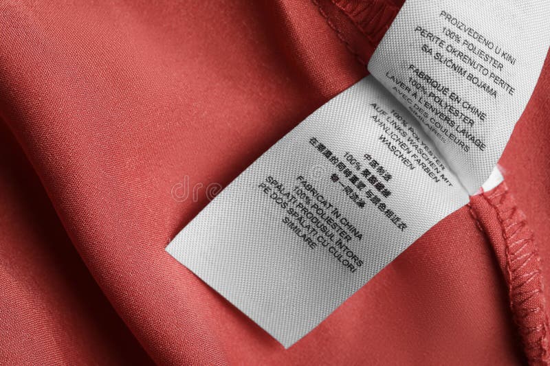 Clothing Labels on Beautiful Garment, Top View. Space for Text Stock ...