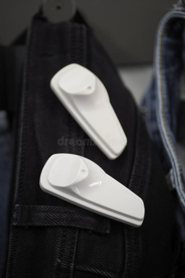 Clothing Security Tag on a Jeans , Stock Image - Image of commercial ...