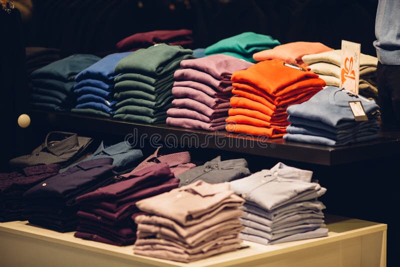 Stack of Folded Colorful Clothes in a Clothing Store Stock Photo ...