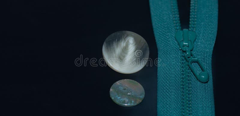 Clothing Zipper and Buttons on a Black Background Stock Photo - Image ...