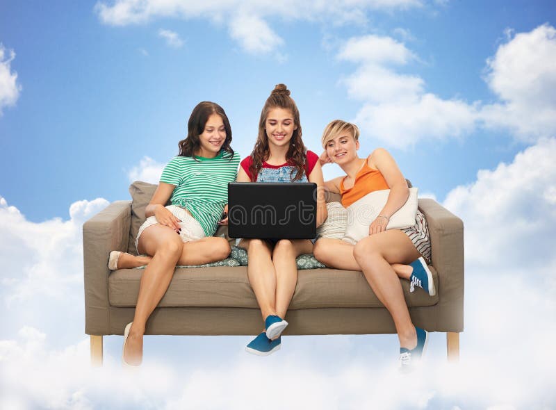 Female Friends with Laptop Computer Over Clouds Stock Photo - Image of ...