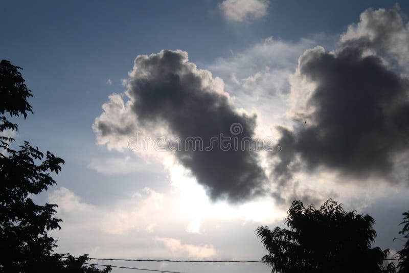 A Cloud Covering the Sun during the Day Stock Image - Image of plant ...