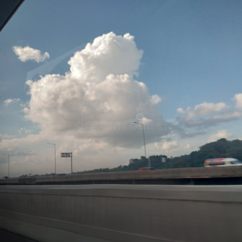A Cloud in the Highway Street Sky Stock Image - Image of cumulus ...