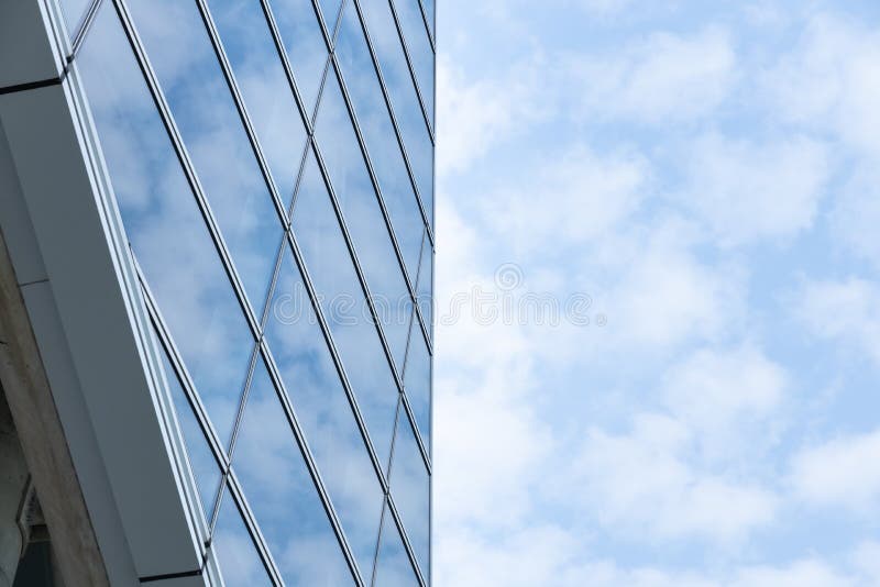 Cloud Reflected on Blue Glass Windows of Building, Divided in Half the ...