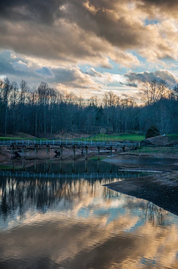 Cloud Reflection on Lake at Golf Course with Bridge Stock Image - Image ...