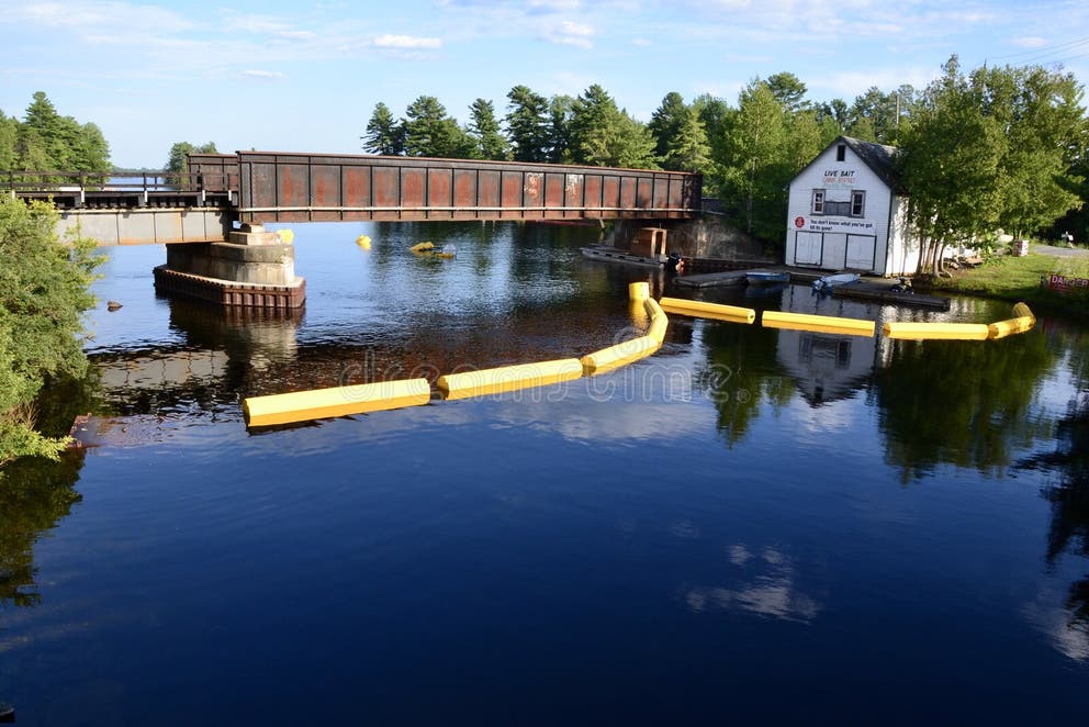 Cloud Reflections and Rail Bridge Spanning River at Bala Falls Stock ...