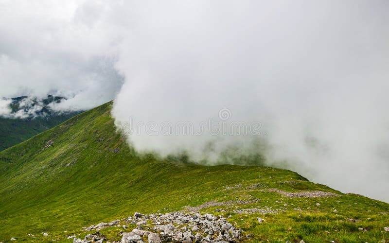 Cloud Rolling Over Mountain Ridge in Scottish Highlands. Stock Image ...