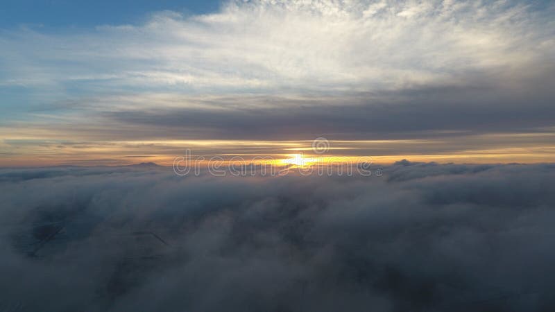 Cloud Sandwich stock photo. Image of daytime, dawn, cloud - 107426842