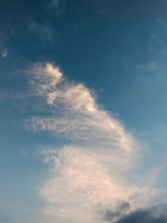 A Cloud Shaped Like Something White Stock Photo - Image of sunlight ...