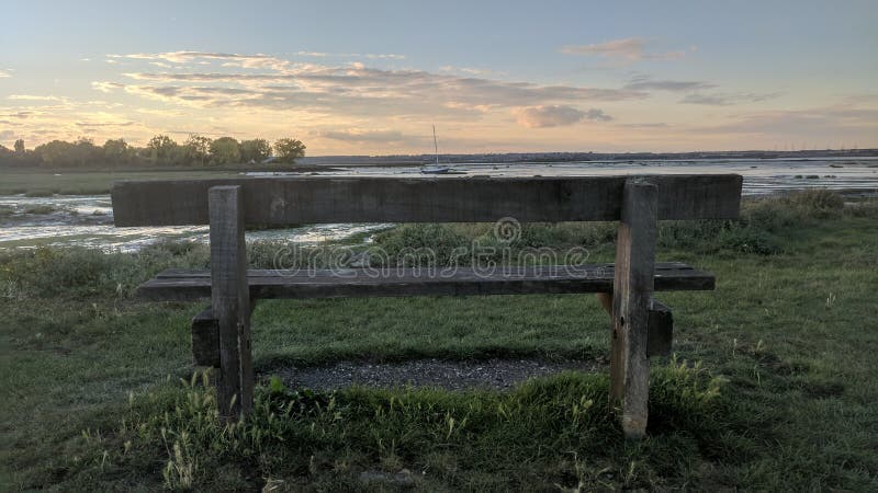 Bench with a Boat on it in the Middle Distance Stock Photo - Image of ...