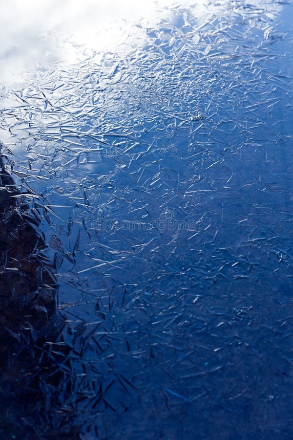 Cloud and Sky Reflections in an Ice Pattern on the Ground Stock Image ...