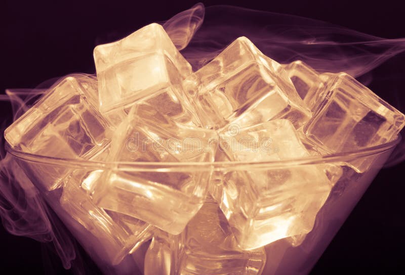 Cloud of Smoke Over Martini Glass with Ice Cubes on Black Background ...