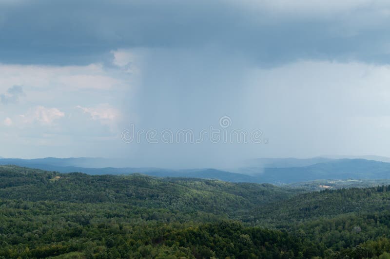 Cloudburst Above Hills Overgrown in Forests during Summer Stock Photo ...