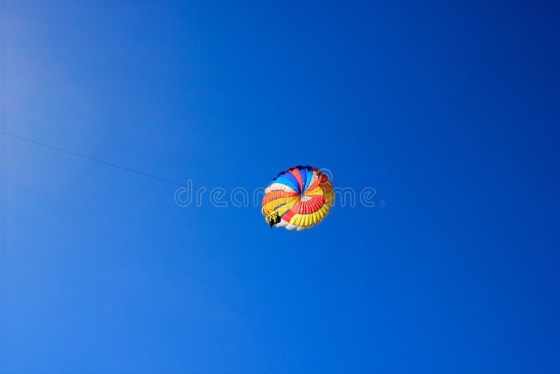 Cloudless day parasailing stock photo. Image of leisure - 104015668