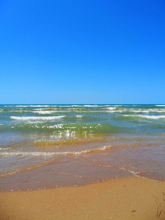 Cloudless Sky, Waves and Sandy Beach Stock Image - Image of water ...