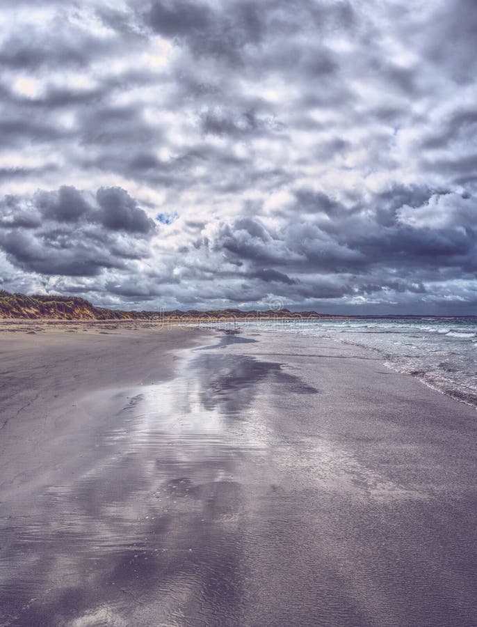 Clouds above sandy beach stock image. Image of seaside - 130423361