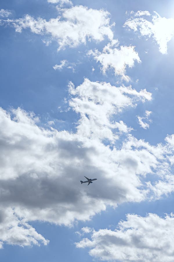 Clouds, Blue Sky and an Airline Plane Ascending Towards Its Destination ...