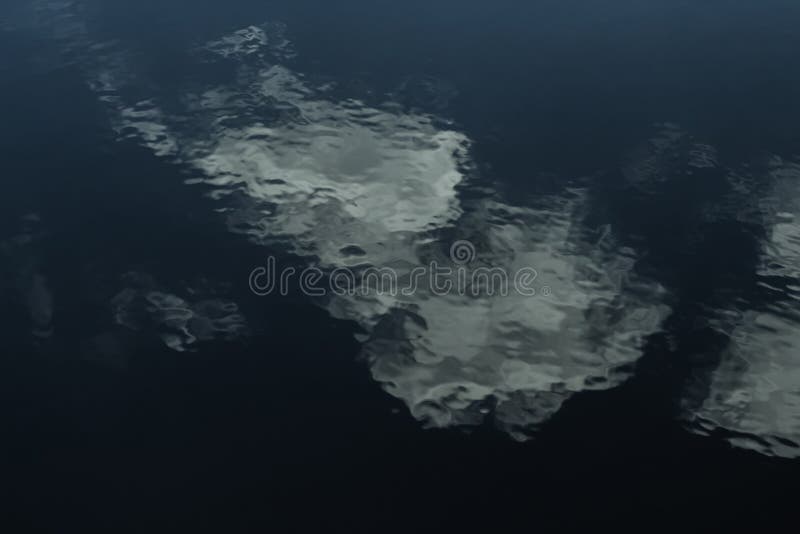 Clouds and Sky Reflected in the Water Stock Photo - Image of ...