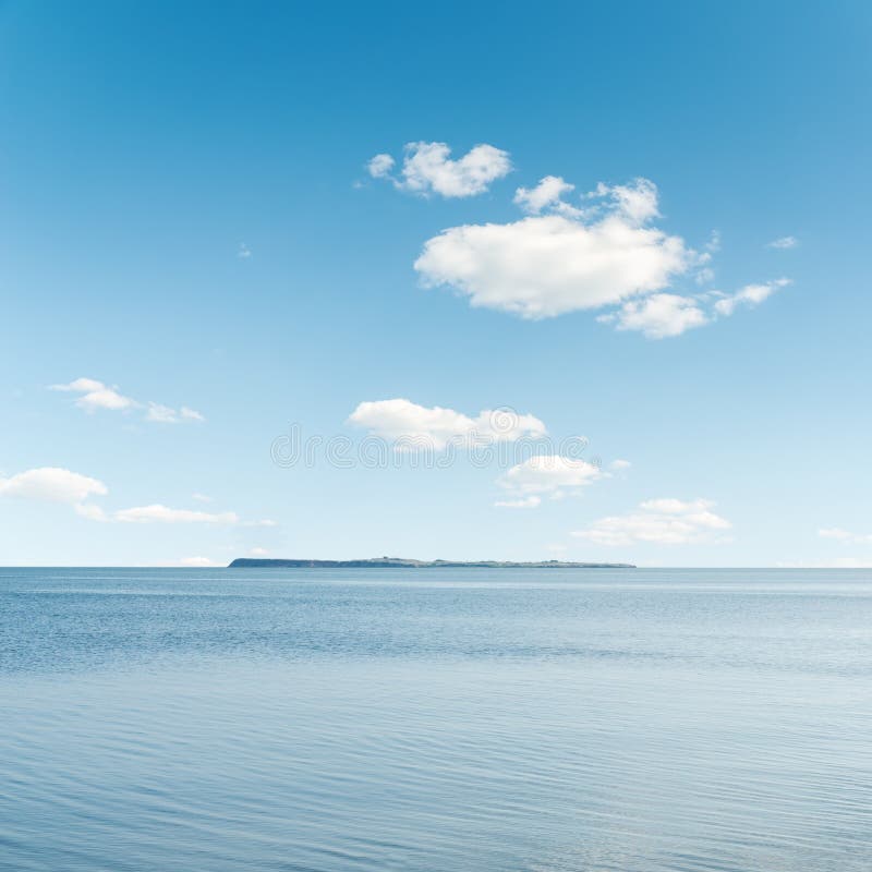 Clouds In Blue Sky Over Sea Stock Photo - Image of reflection, cloud ...