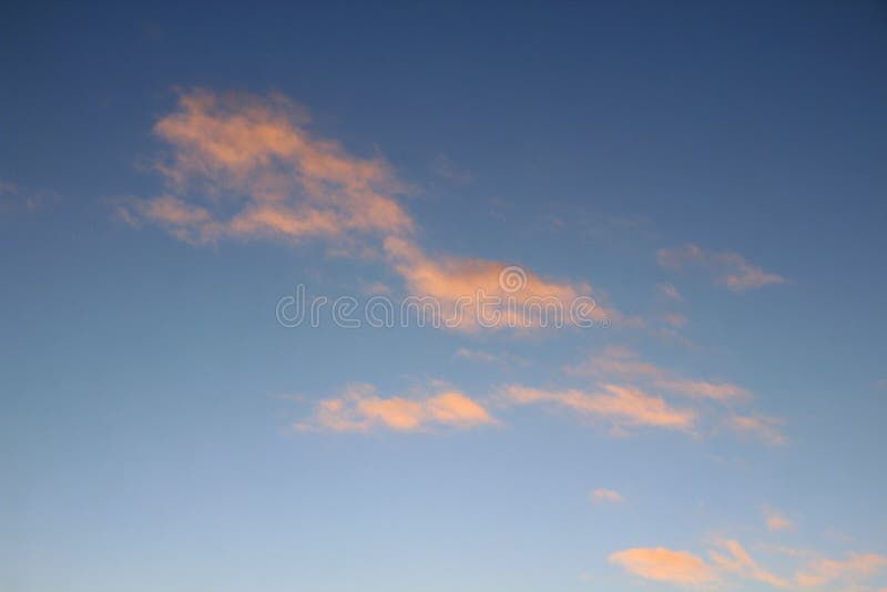 Clouds in the Blue Sky at Sunset or Dawn Backlit by the Sun. Place for ...