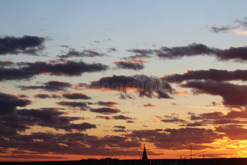 Clouds in the Blue Sky at Sunset or Dawn Backlit by the Sun. Place for ...