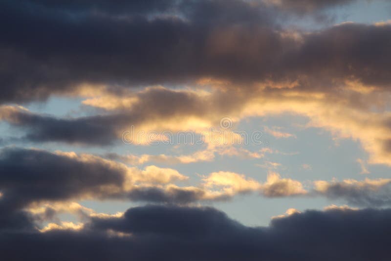 Clouds in the Blue Sky at Sunset or Dawn Backlit by the Sun. Place for ...