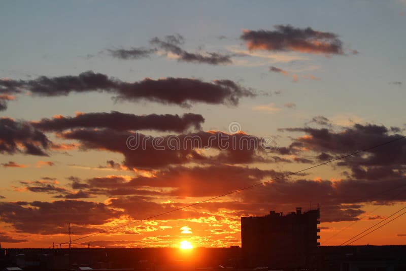 Clouds in the Blue Sky at Sunset or Dawn Backlit by the Sun. Place for ...