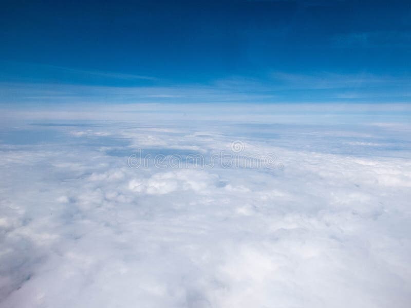 Clouds and Clear Bright Blue Sky. Aerial View from Plane Illuminator ...