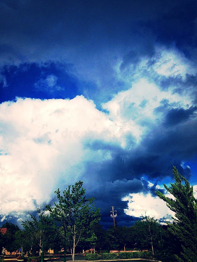 Clouds of Different Colors Over Very Blue Sky Stock Image - Image of ...