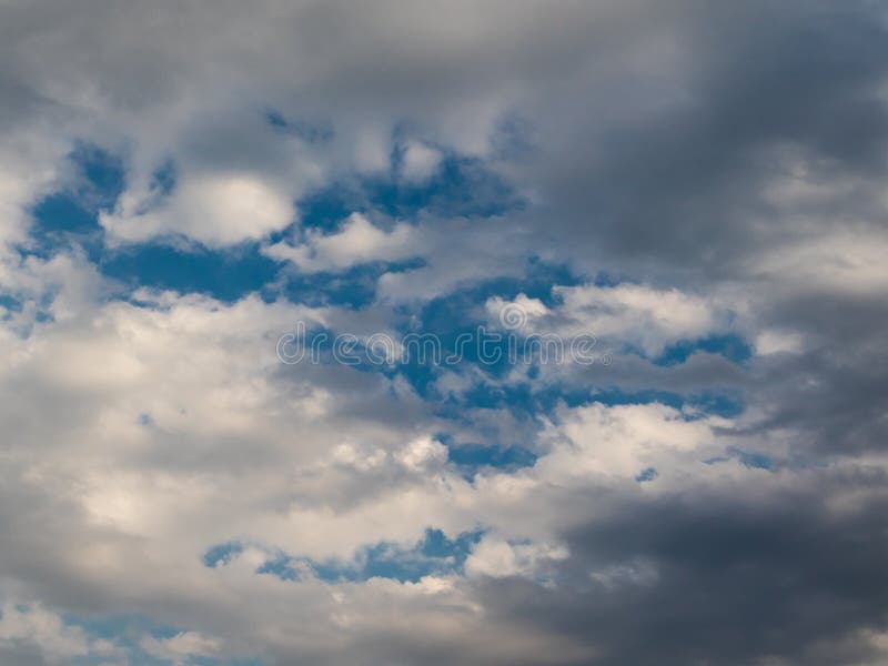 Clouds Dramatically Scattered Across a Darkening Sky, Hinting at an ...