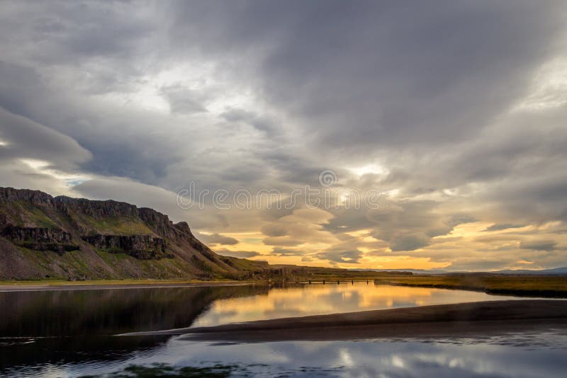 Clouds at Dusk, Reflected on a River, Iceland. Stock Image - Image of ...