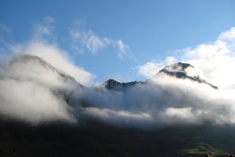 Clouds fall to the ground. stock photo. Image of mountains - 97940894